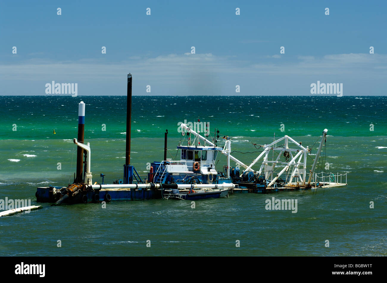 Coastal dredger at work Stock Photo - Alamy