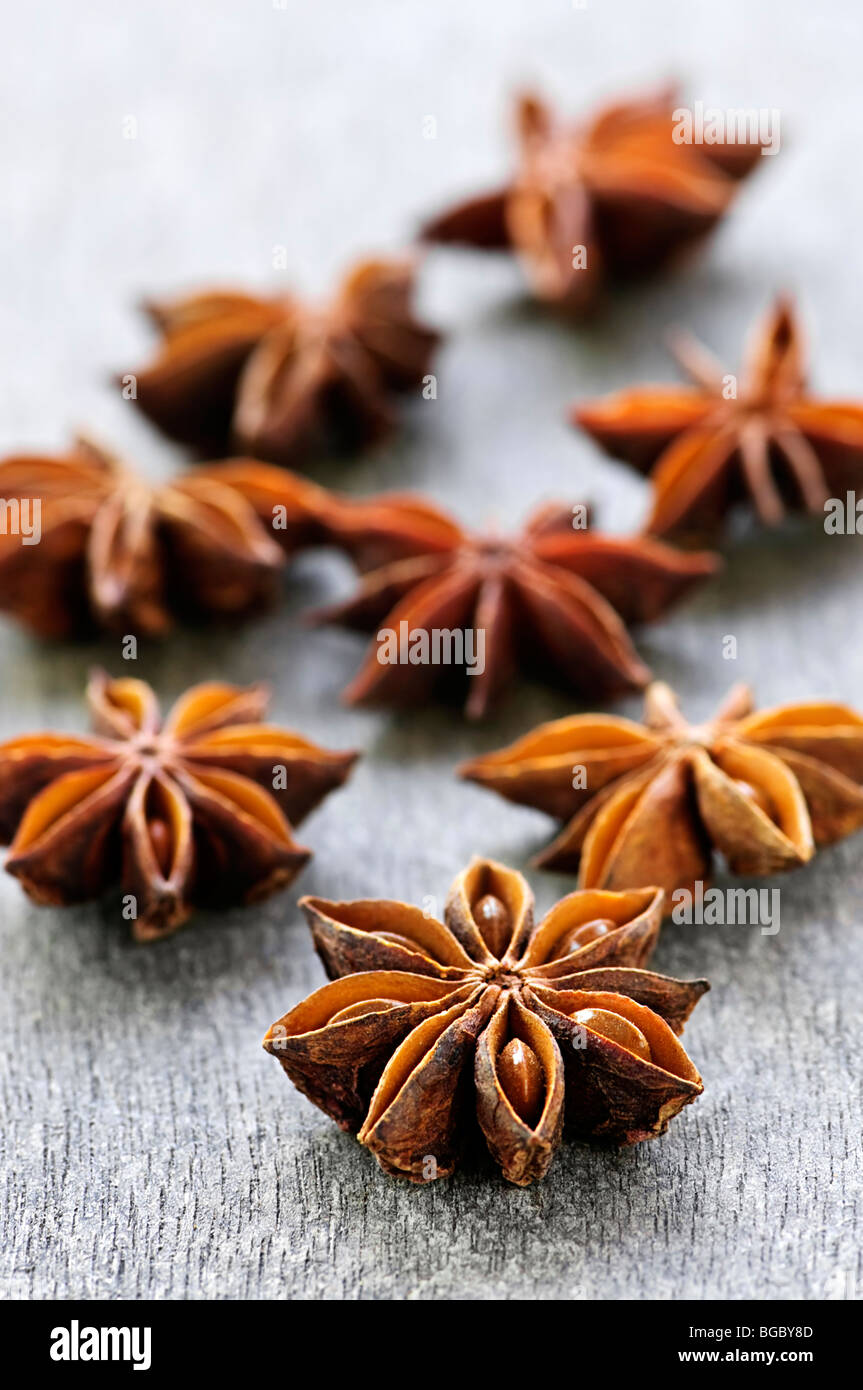 Dry star anise fruit and seeds on wooden background Stock Photo - Alamy