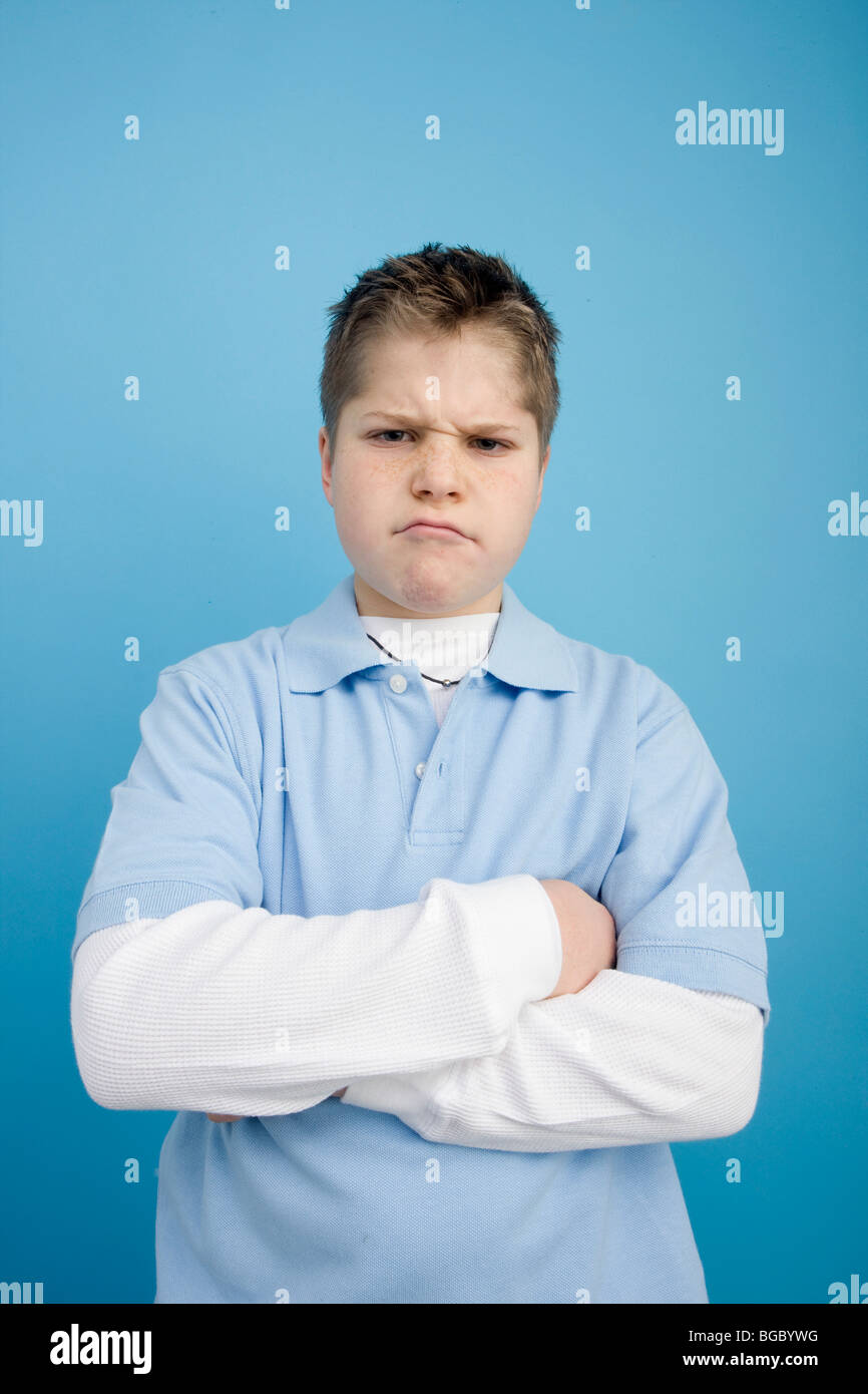 Grumpy boy arms crossed hi-res stock photography and images - Alamy