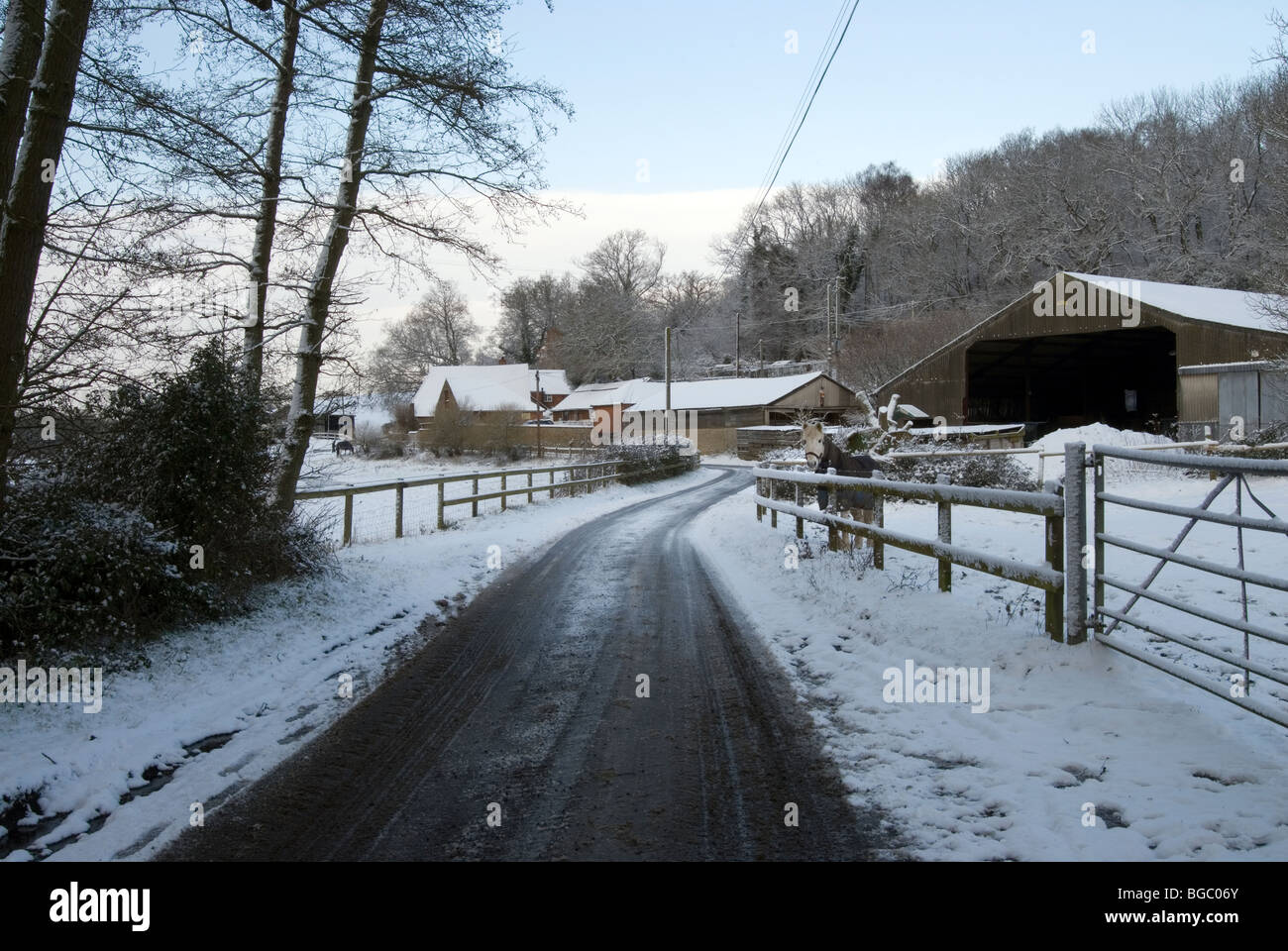 Winter snow scene with farm gate and trees hi-res stock photography and ...