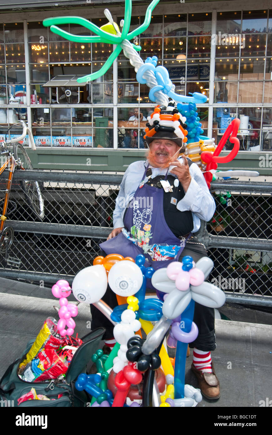 USA, Washington, Seattle. Balloon man busker at Pike Place Market Stock ...