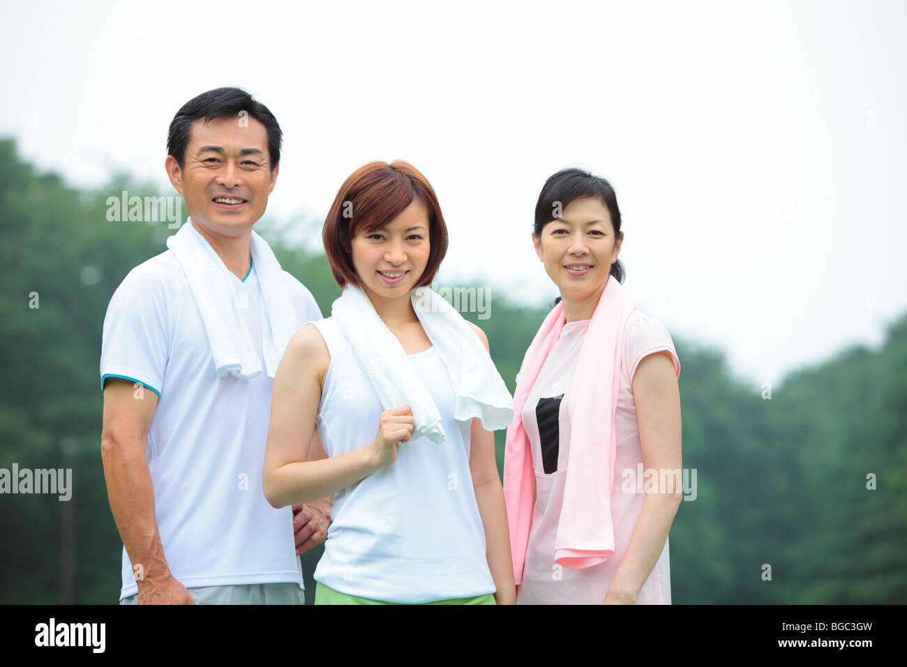 Portrait of three people in sportswear Stock Photo - Alamy