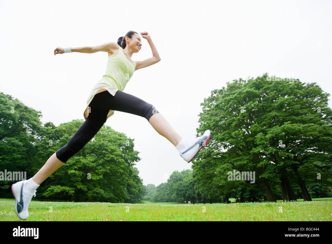 Mid adult woman stepping Stock Photo - Alamy
