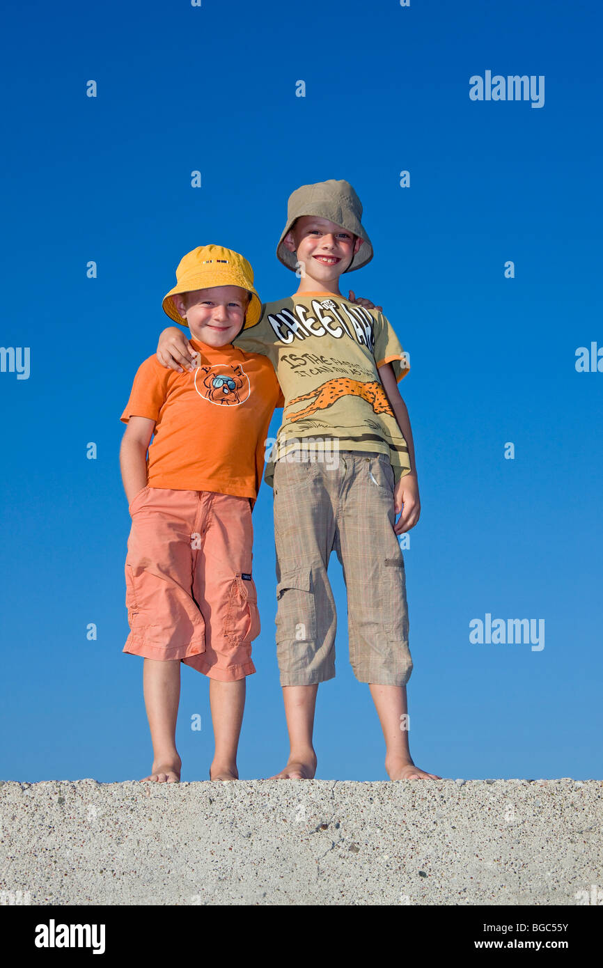 Two boys stand hi-res stock photography and images - Alamy
