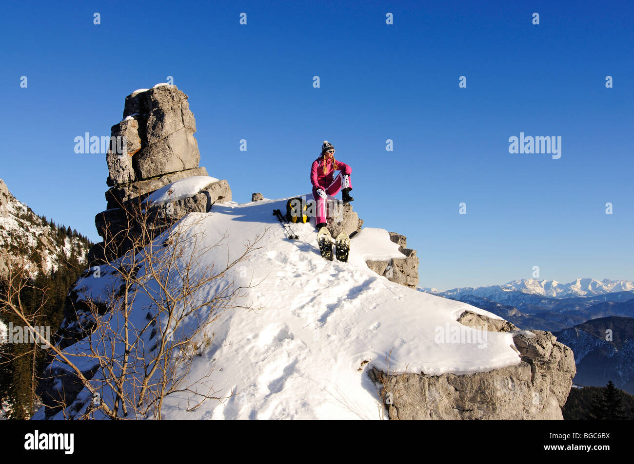 Blond woman with snow shoes hi-res stock photography and images - Alamy