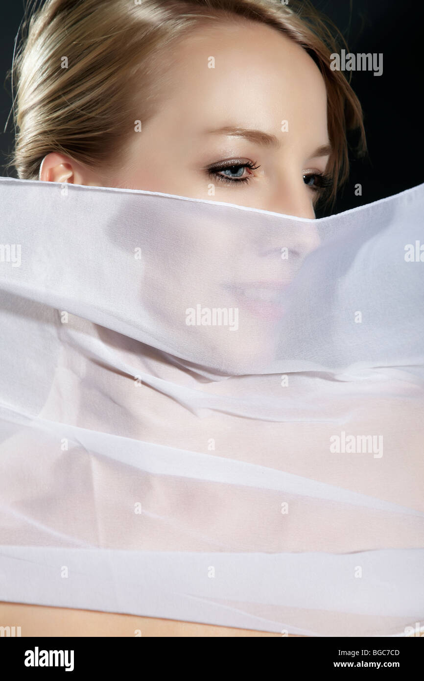 Female face covered cloth hi-res stock photography and images - Alamy