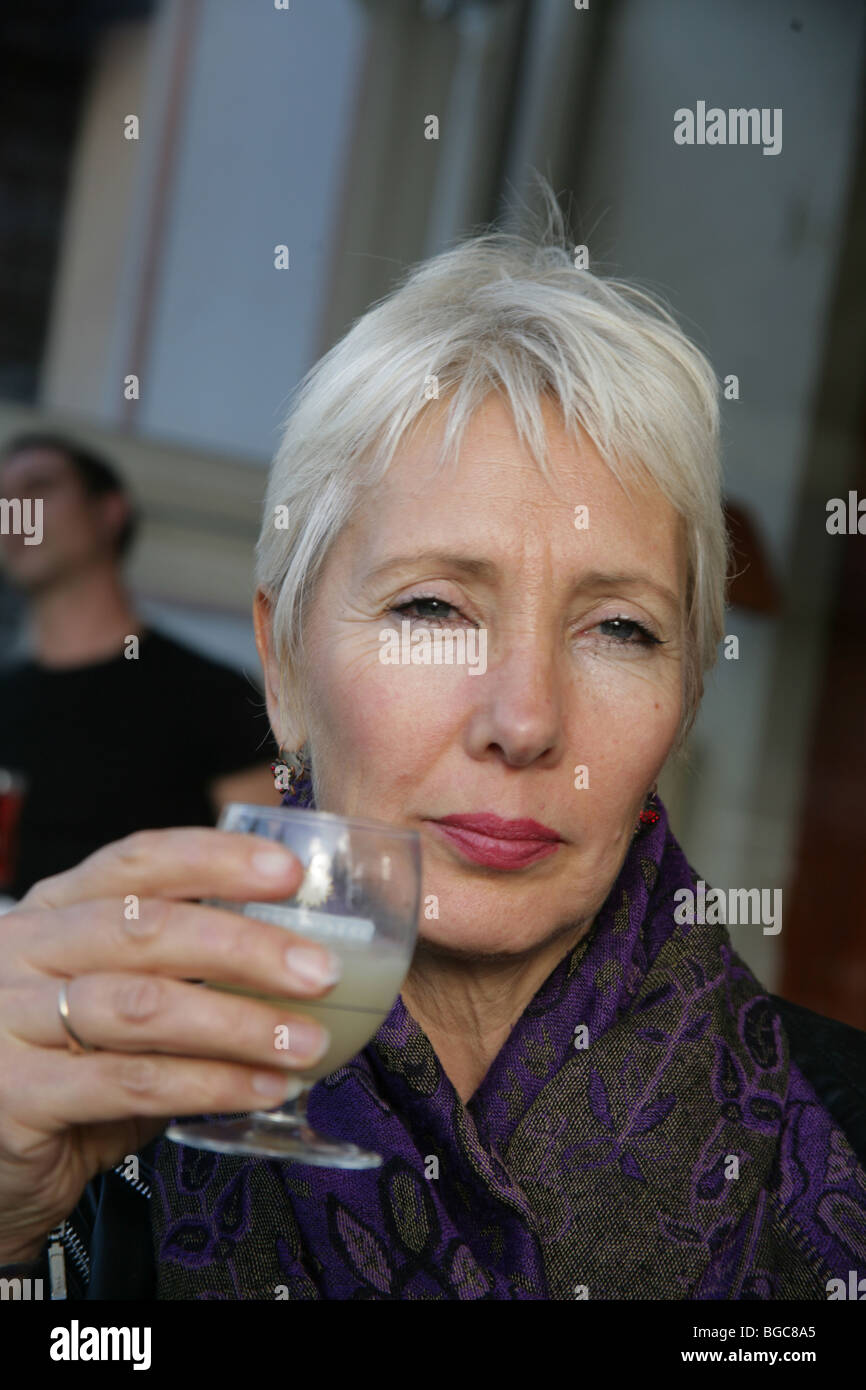 Woman drinking pastis Stock Photo - Alamy