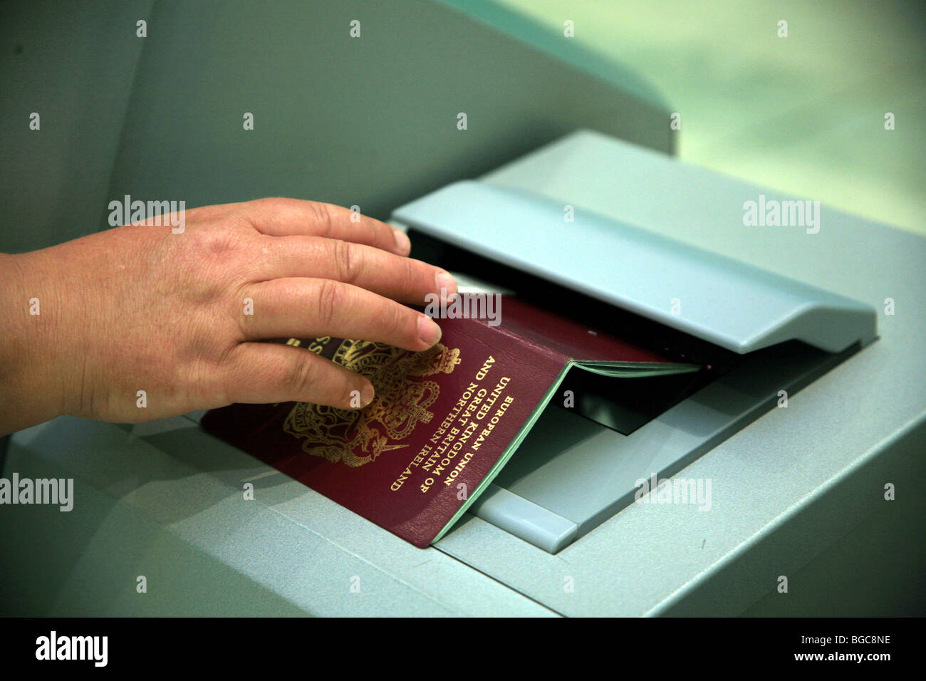 Self-check in and using a passport scanner at Dubai Airport Stock Photo ...