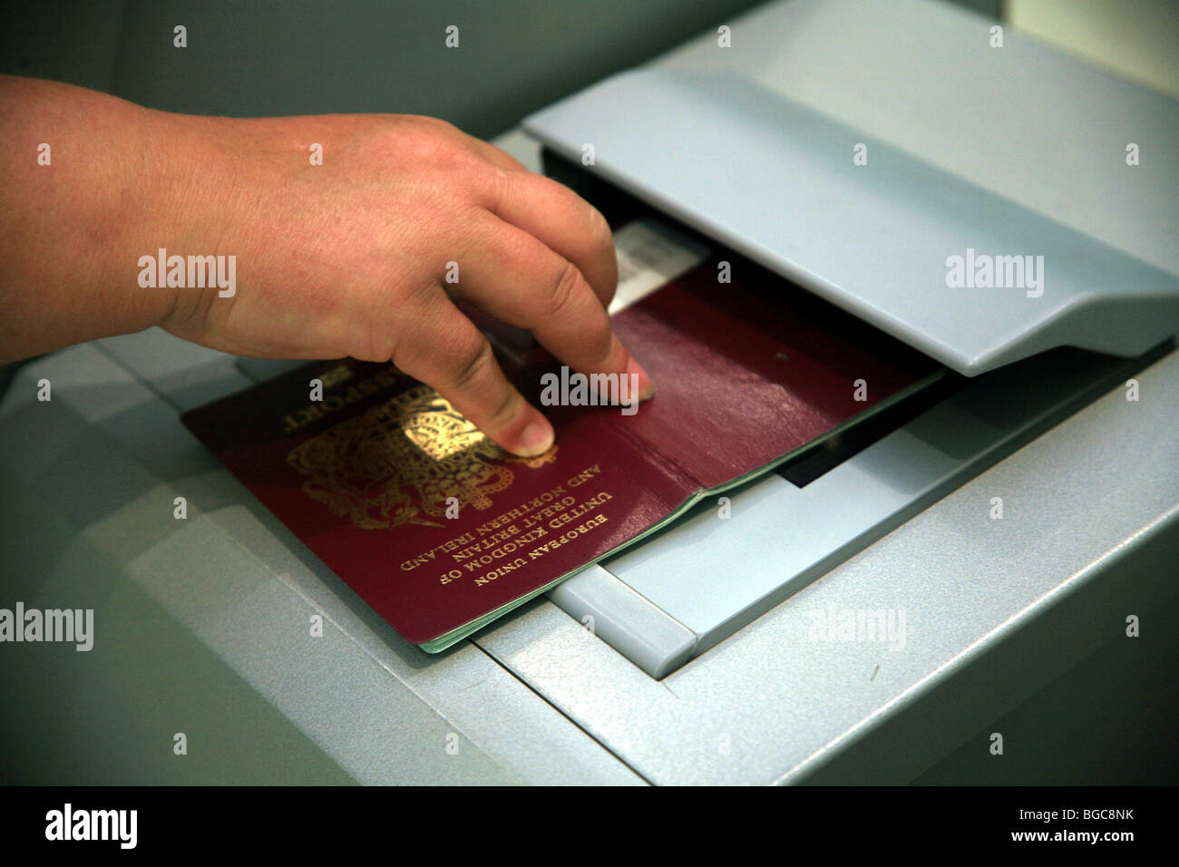 Self-check in and using a passport scanner at Dubai Airport Stock Photo ...