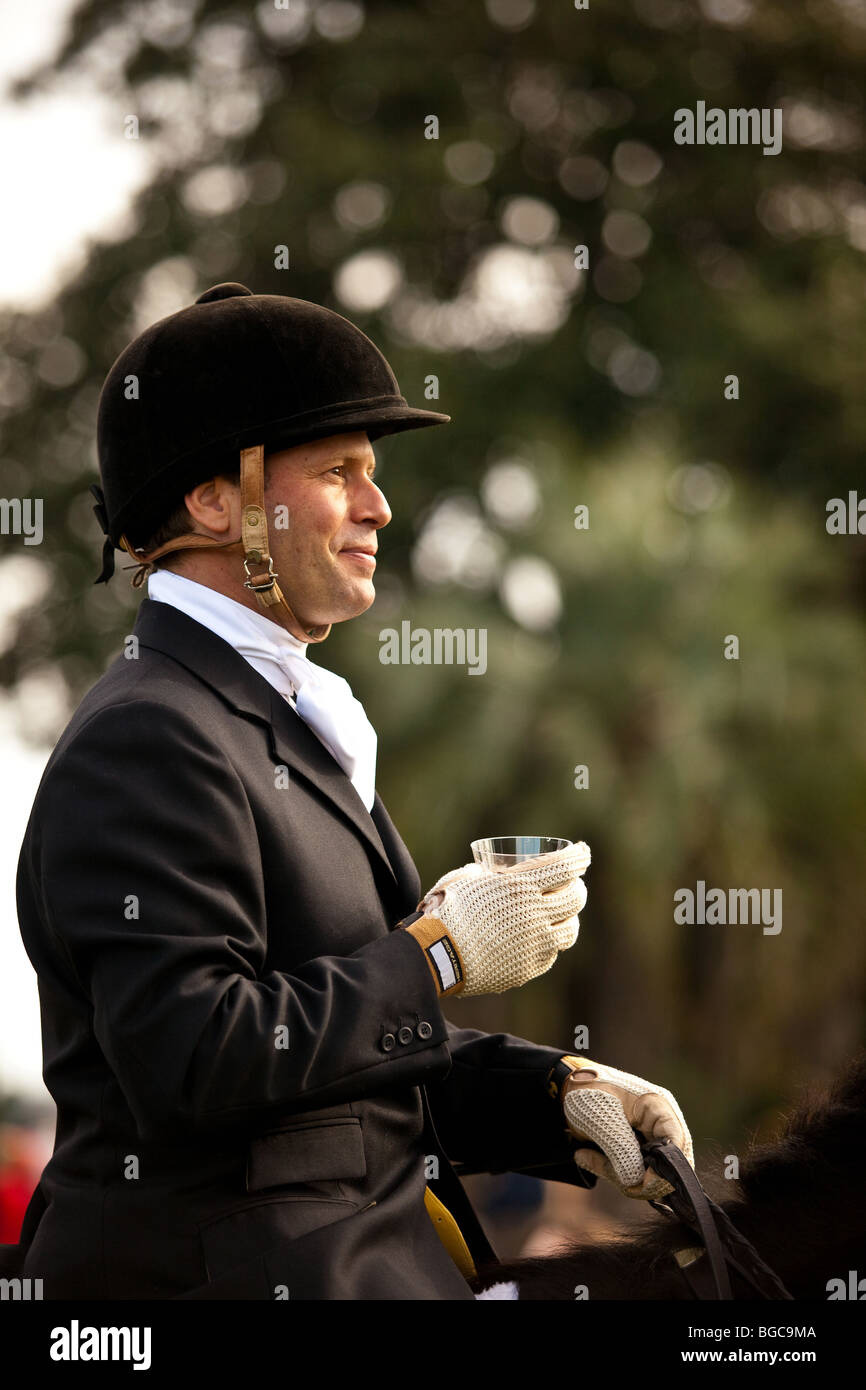 A fox hunter before the start of the foxhunt on the greensward of ...