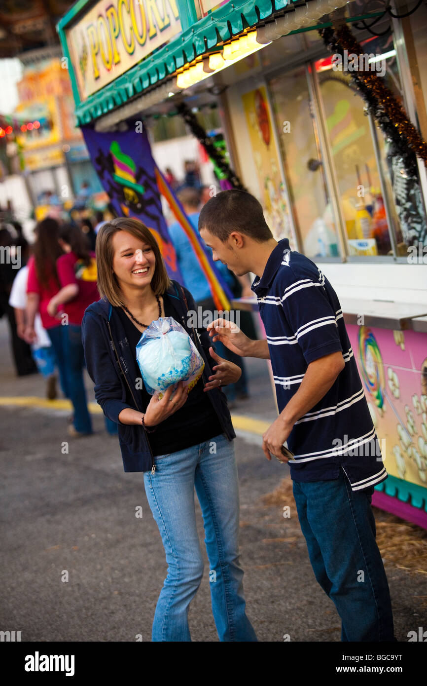 A couple eats cotton candy at the South Carolina Coastal Fair in ...