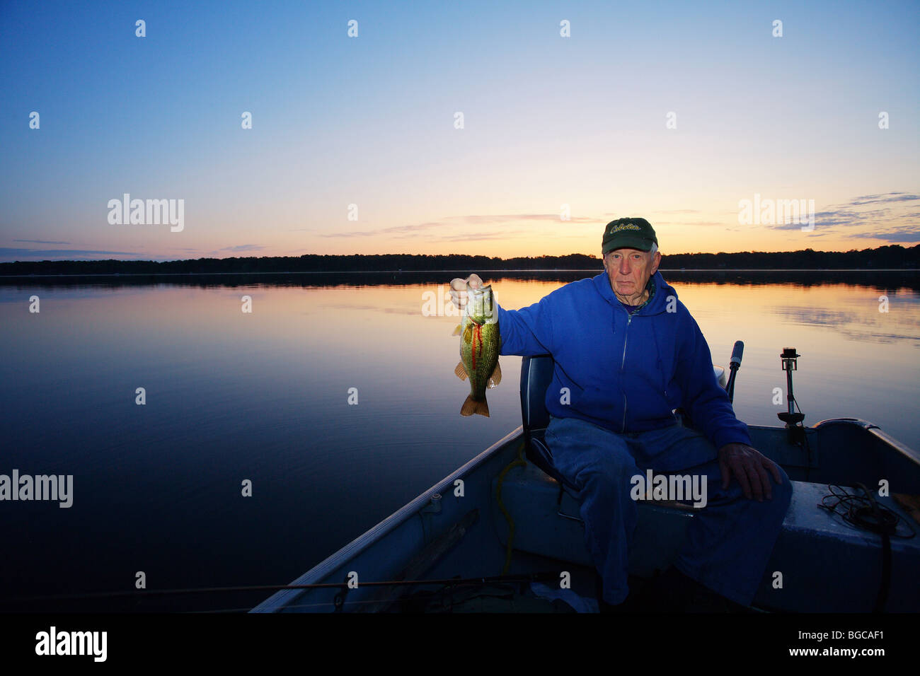 senior elderly fishing guide fisherman holding up monster five 5 pound ...