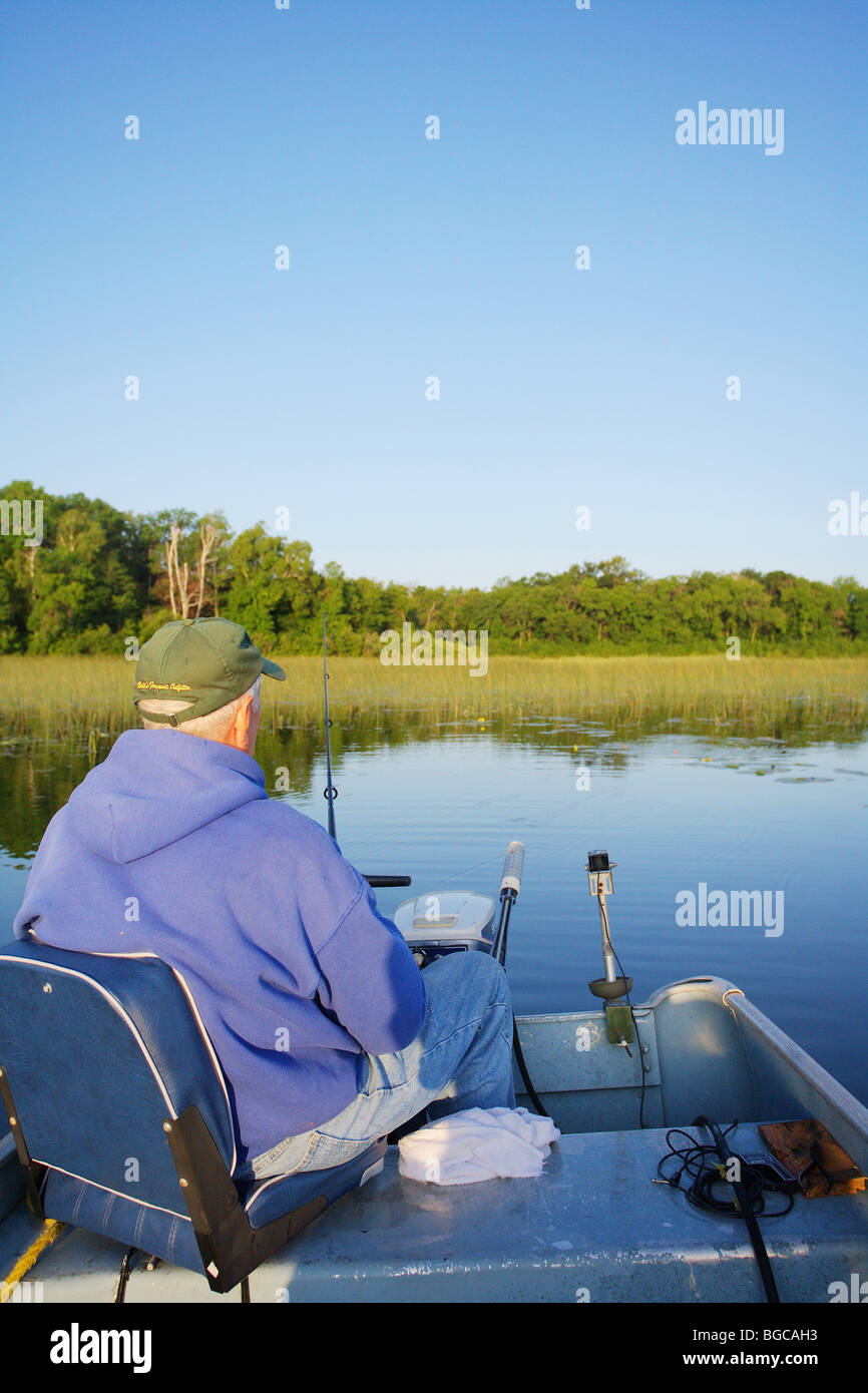 seasoned elderly senior fishing guide fishing in alumnacraft boat Stock ...