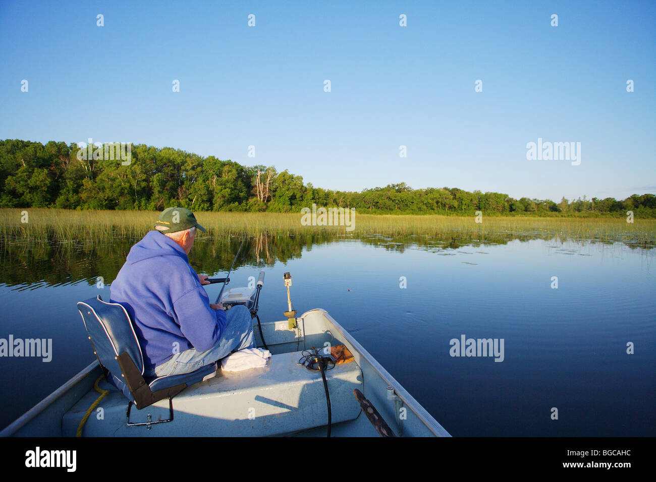 seasoned elderly senior fishing guide fishing in alumnacraft boat Stock ...