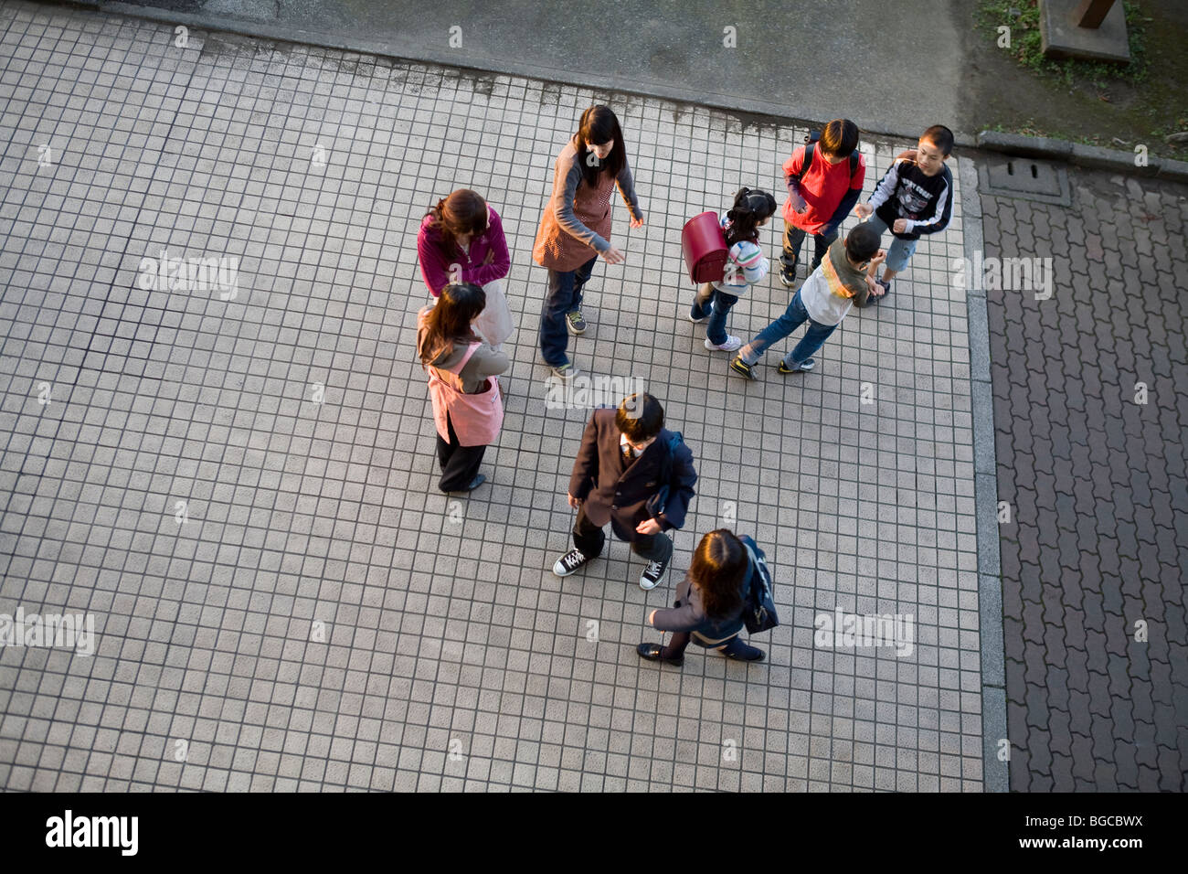 Residents in housing complex Stock Photo - Alamy