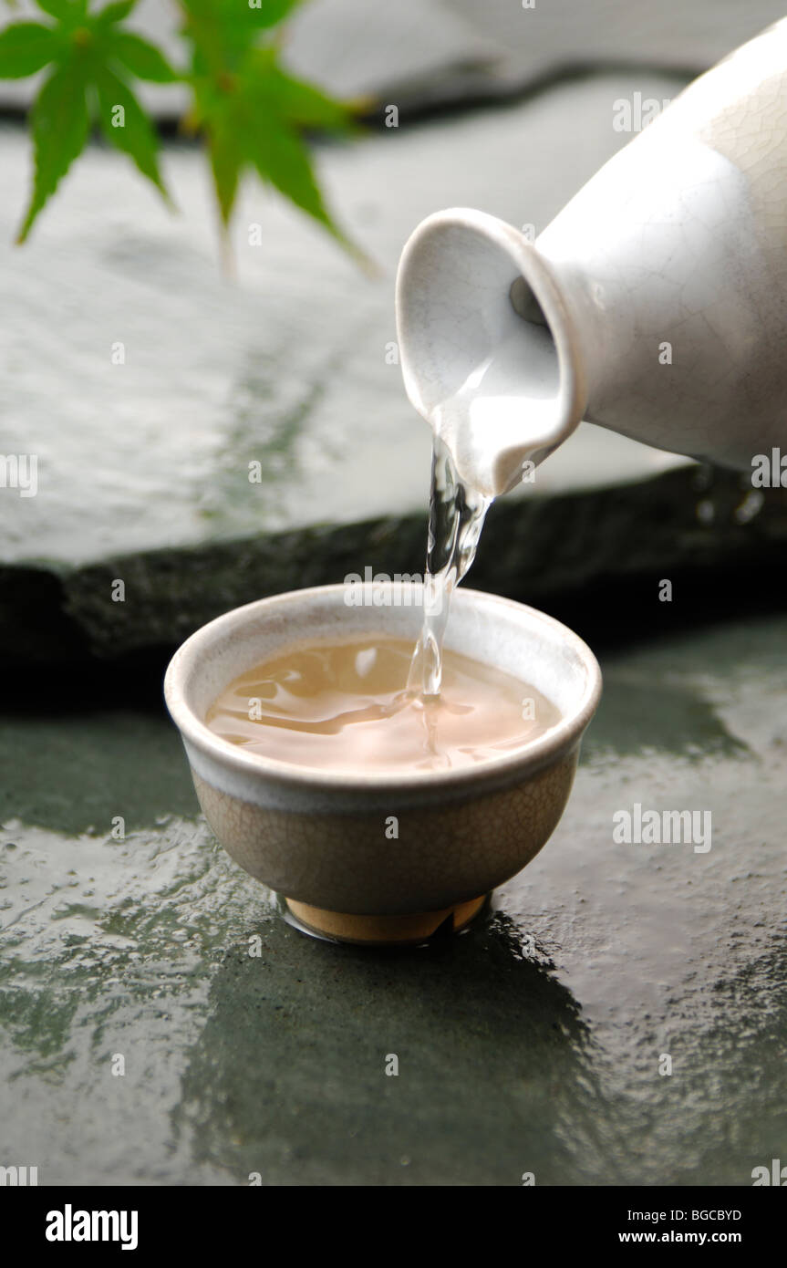 Sake pouring into sake cup Stock Photo - Alamy