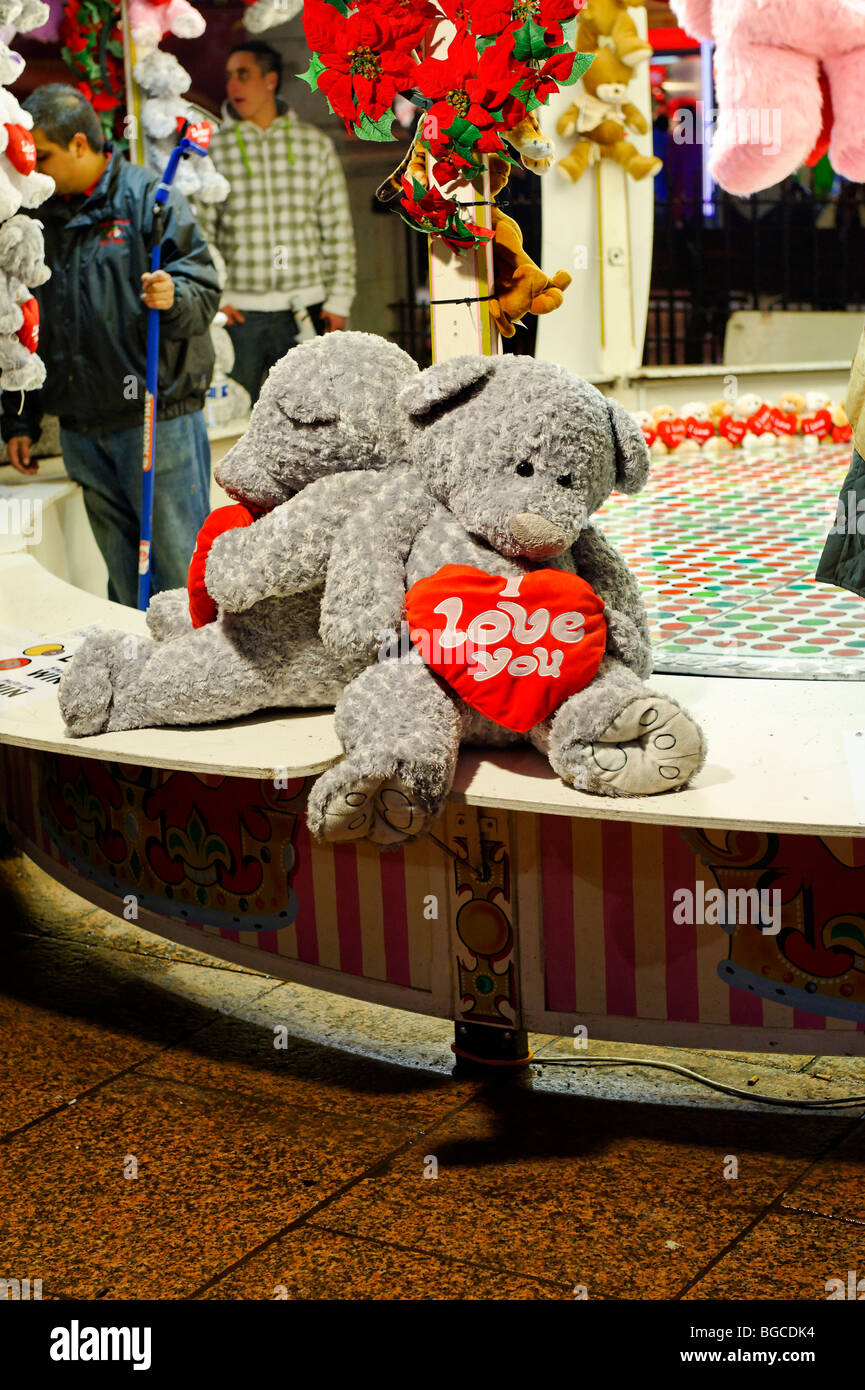 "I love you" - the prize teddy bear on a stall at the Leicester Square Christmas fun fair in ...