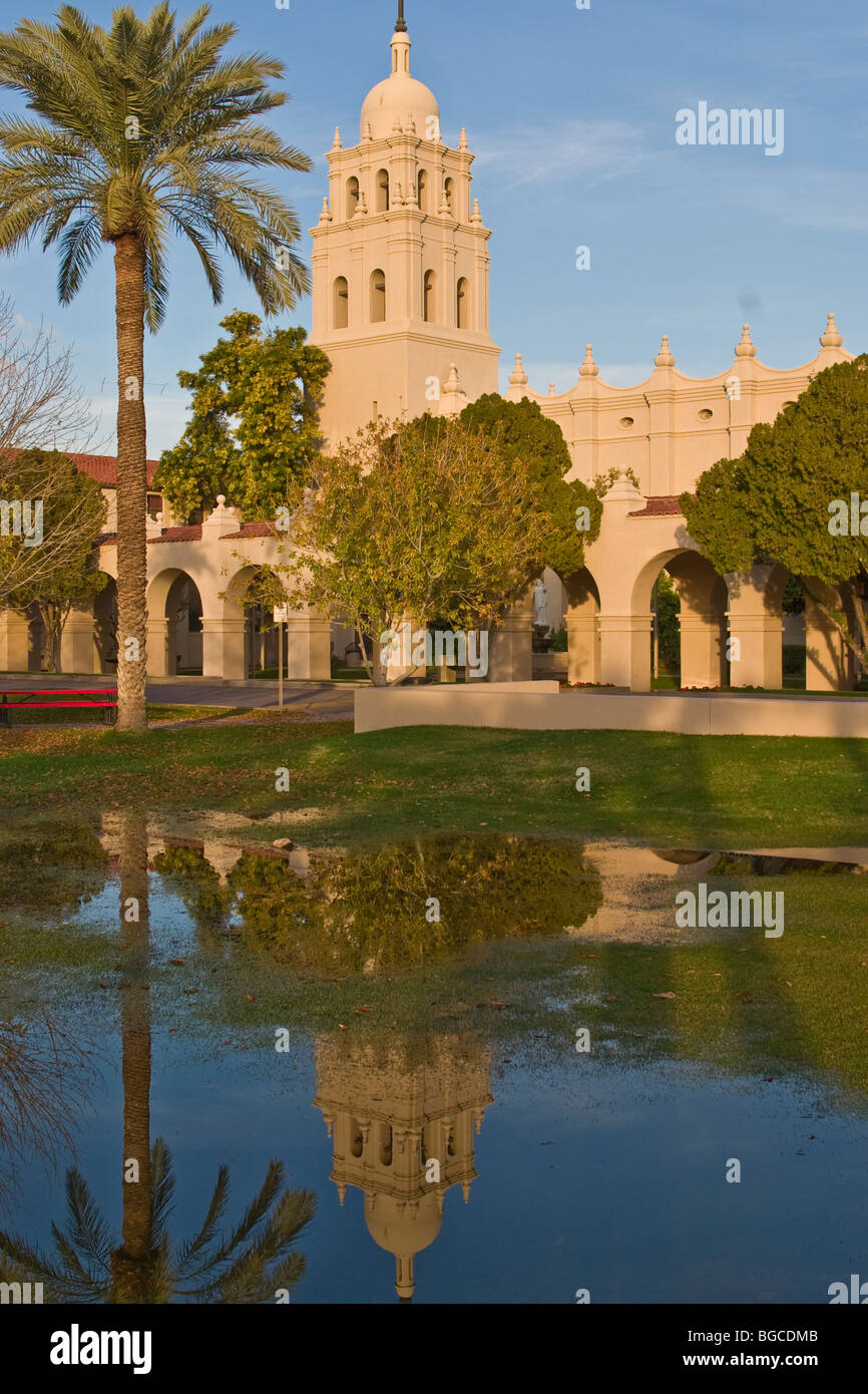 A domed bell tower and palm tree reflection on a religious school ...