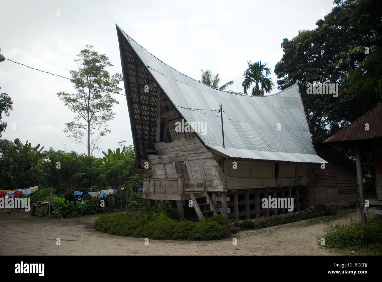 The characteristic sweeping prow-shaped roofs of Batak houses Stock ...