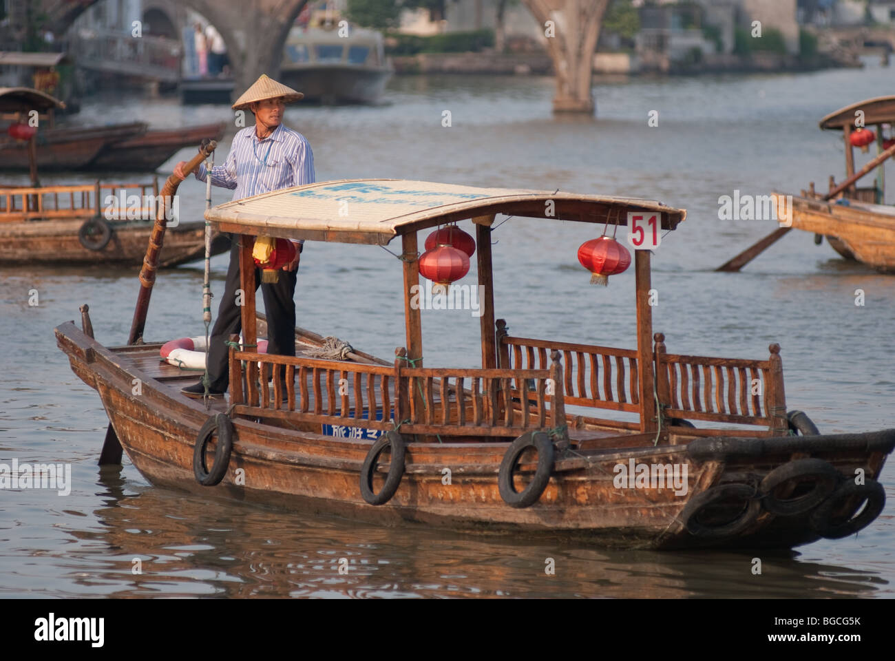 A boatman in the Cao Gang River, Zhujiajiao, China Stock Photo - Alamy