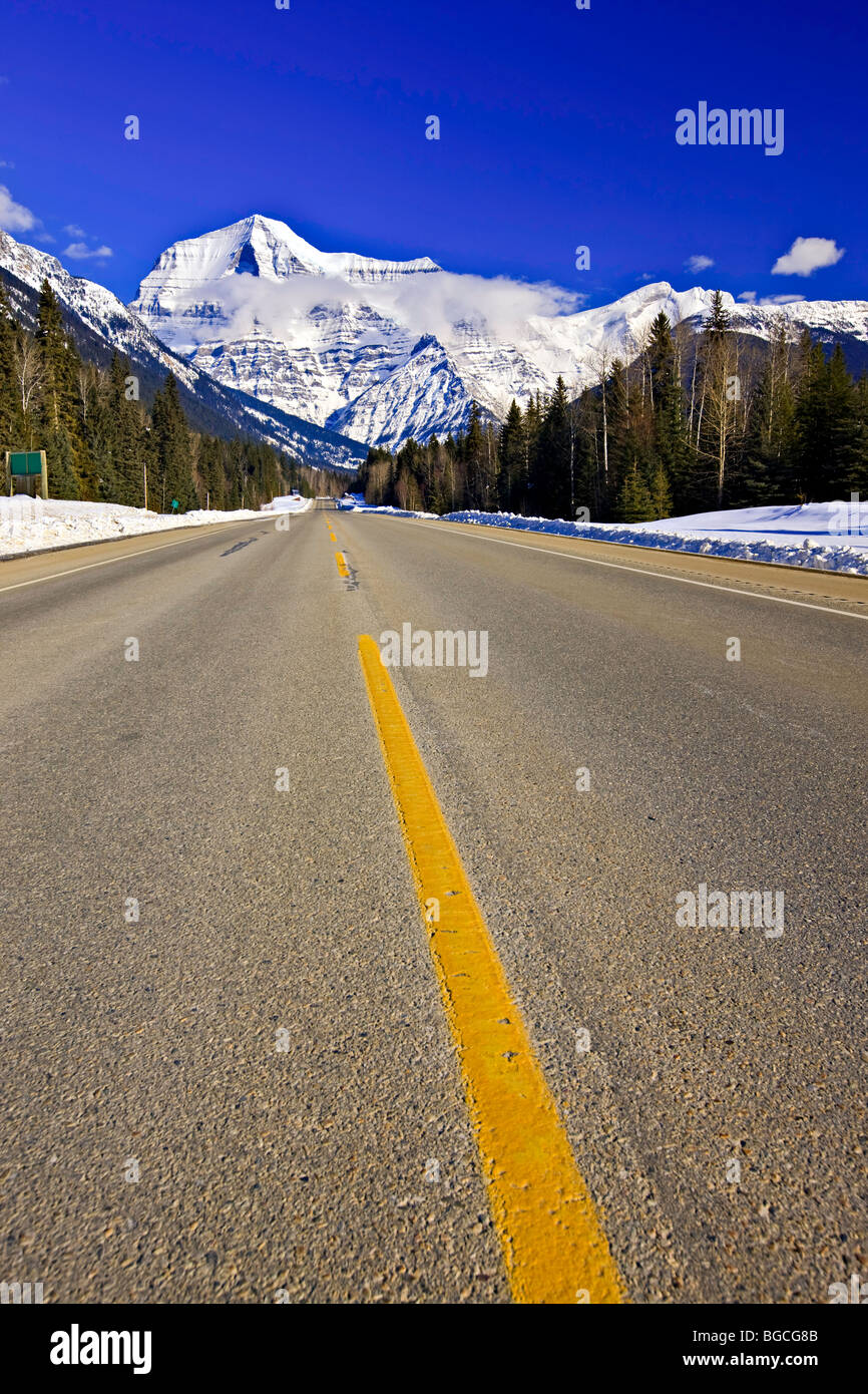 Yellowhead Highway # 16 leading towards the snow-capped Mount Robson ...