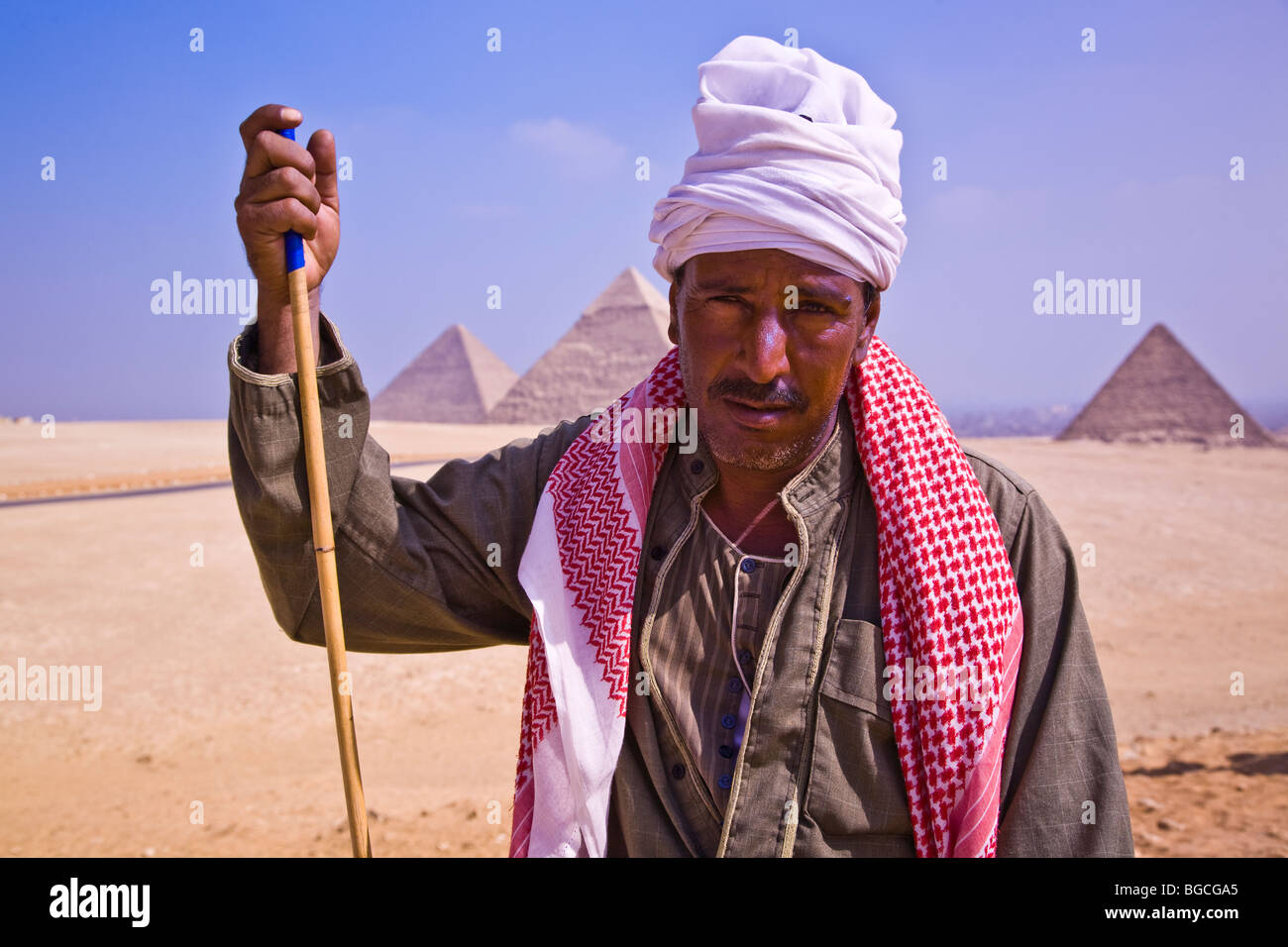 Close up of a male Egyptian camel driver who gives camel rides at the Pyramids of Giza near ...