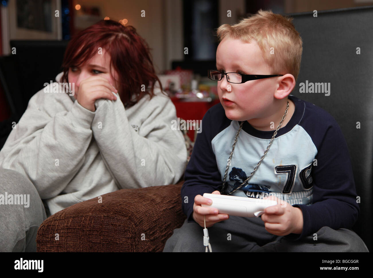 Kids playing on the Wii Stock Photo - Alamy