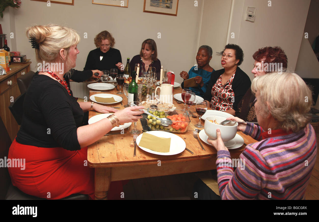 Group of adults having dinner together Stock Photo - Alamy