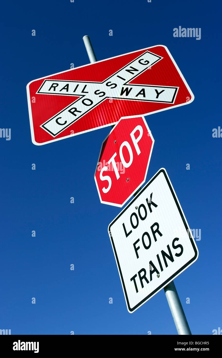 Railway crossing warning sign Stock Photo - Alamy