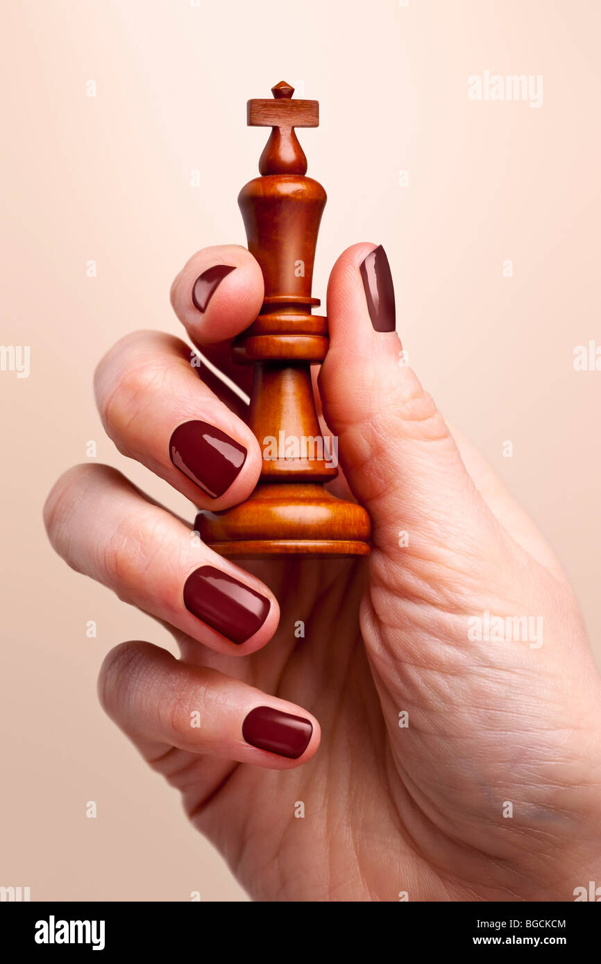 Hand holding chess piece hi-res stock photography and images - Alamy