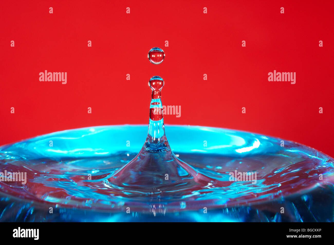 Water Drops splashing into a container of water Stock Photo - Alamy