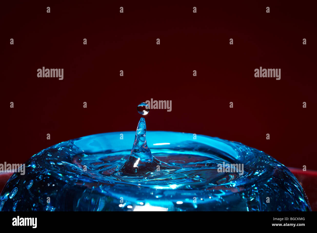 Water Drops splashing into a container of water Stock Photo - Alamy