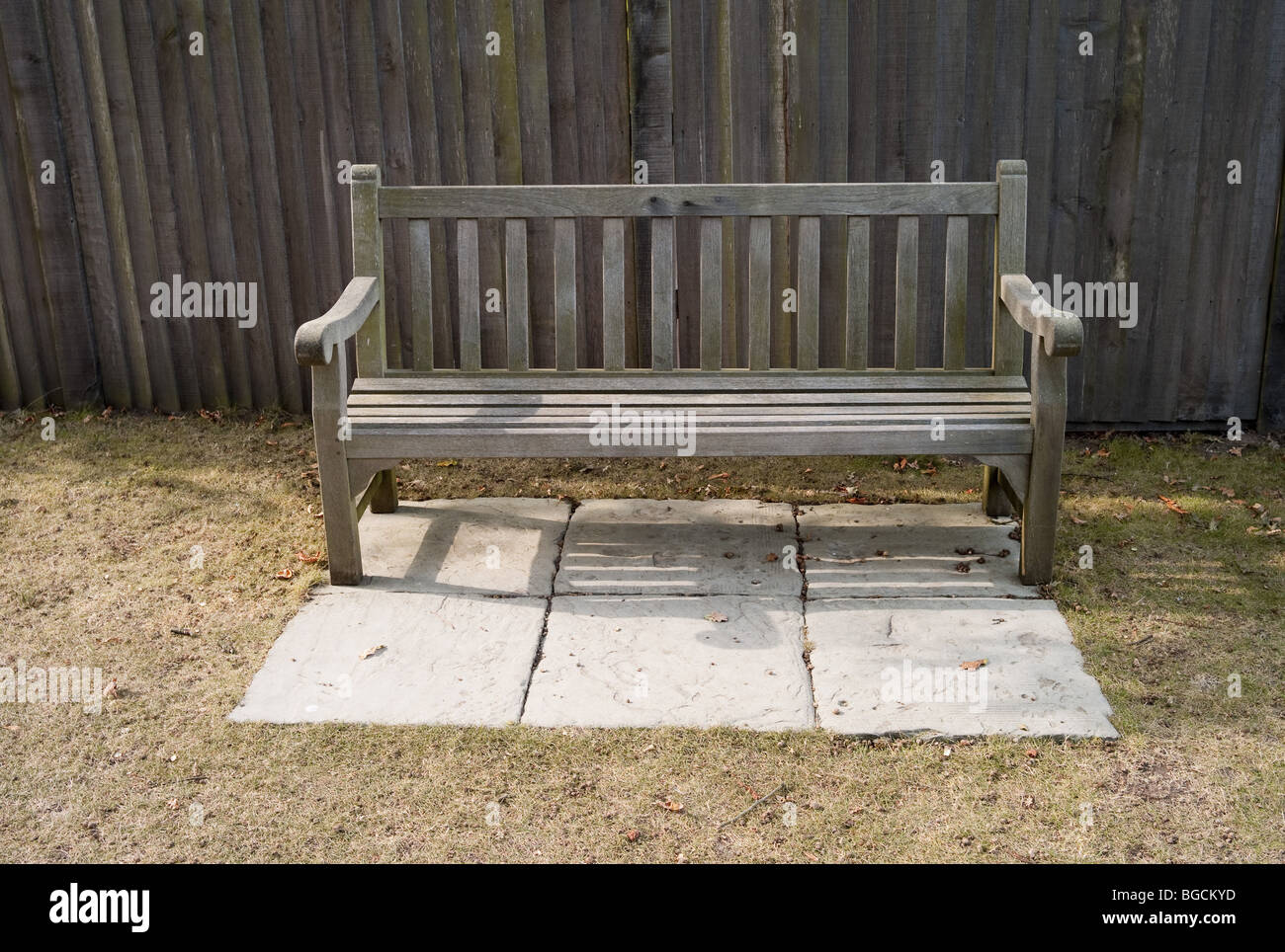 a bench in a country garden Stock Photo - Alamy