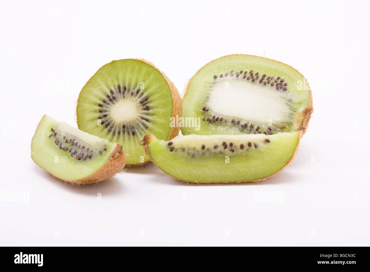 Fresh ripe Kiwi Fruit Segments isolated against white background Stock ...