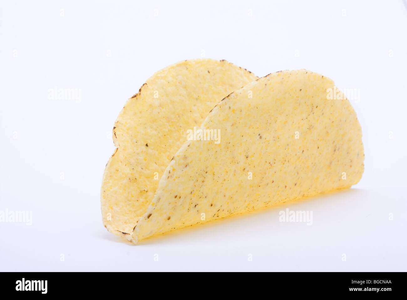 Empty Taco shell isolated against white background Stock Photo - Alamy