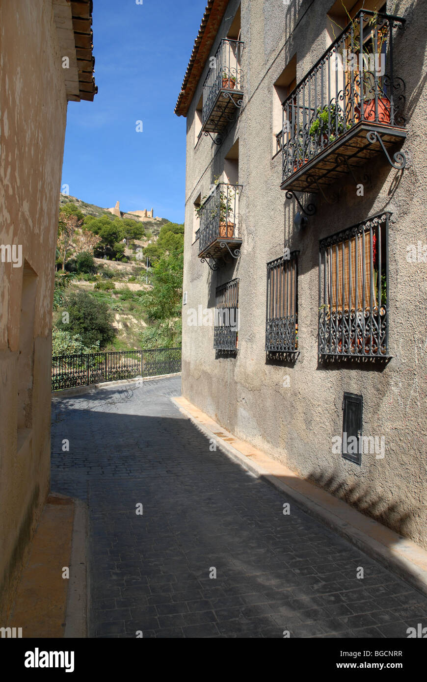 village street scene and ruined castle of Relleu, Alicante Province ...