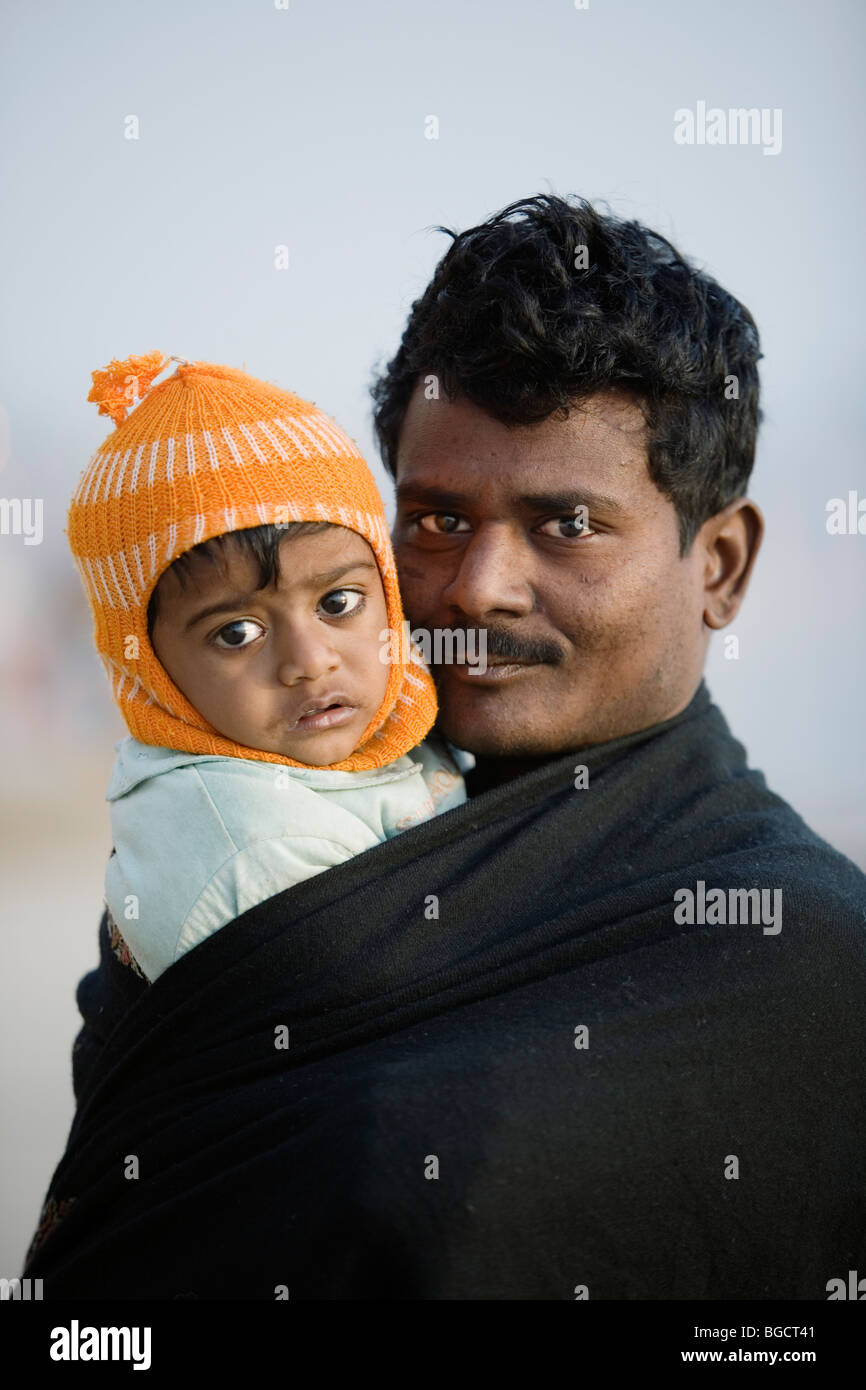 Man with his child in the cool morning in Varanasi, india Stock Photo ...