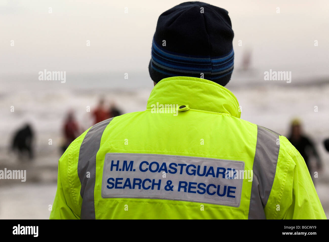 A member of HM Coastguard Search and Rescue wears a high visibility ...