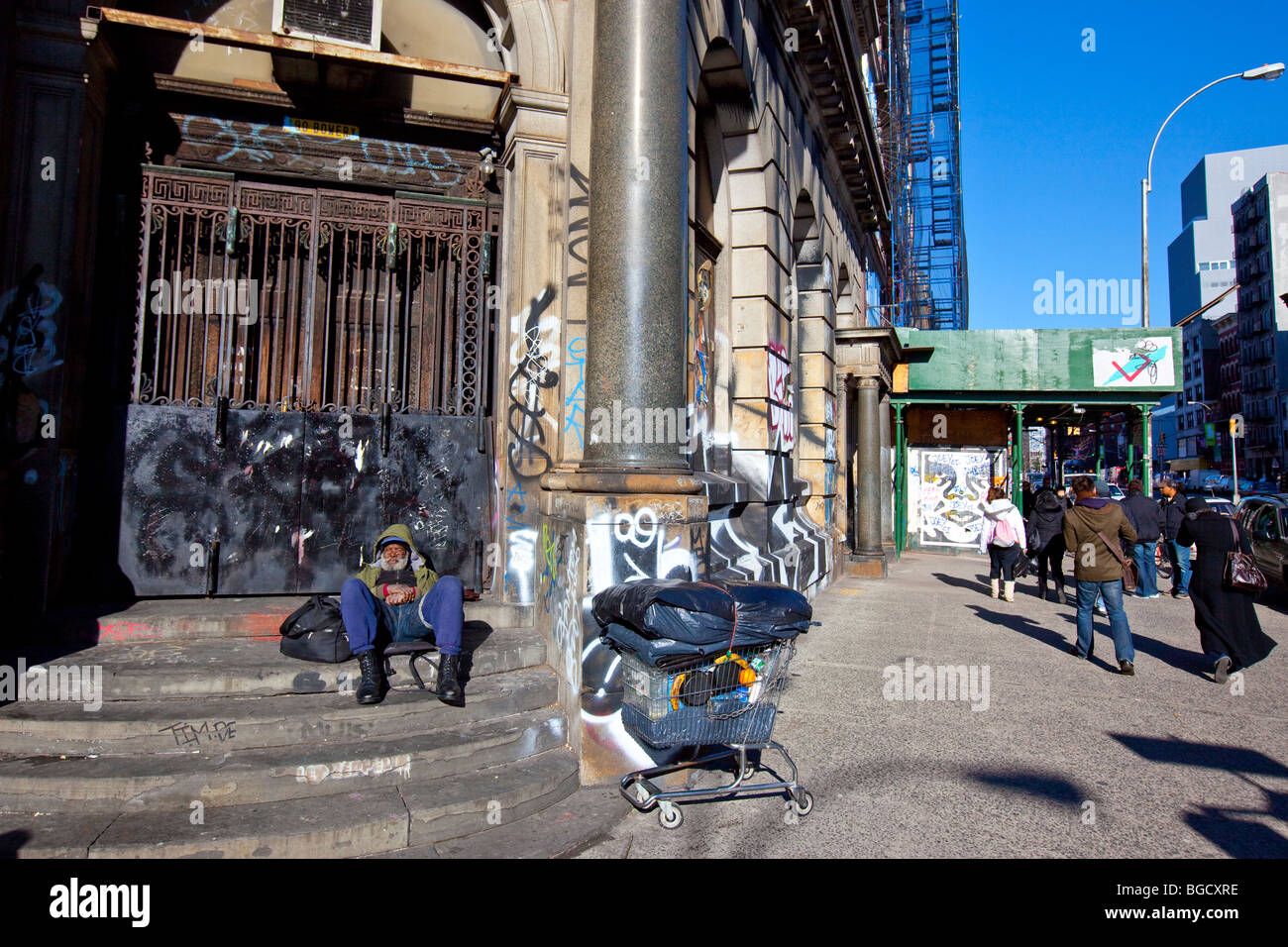 Homeless man in front of 190 Bowery Germania Bank Building, Lower East ...