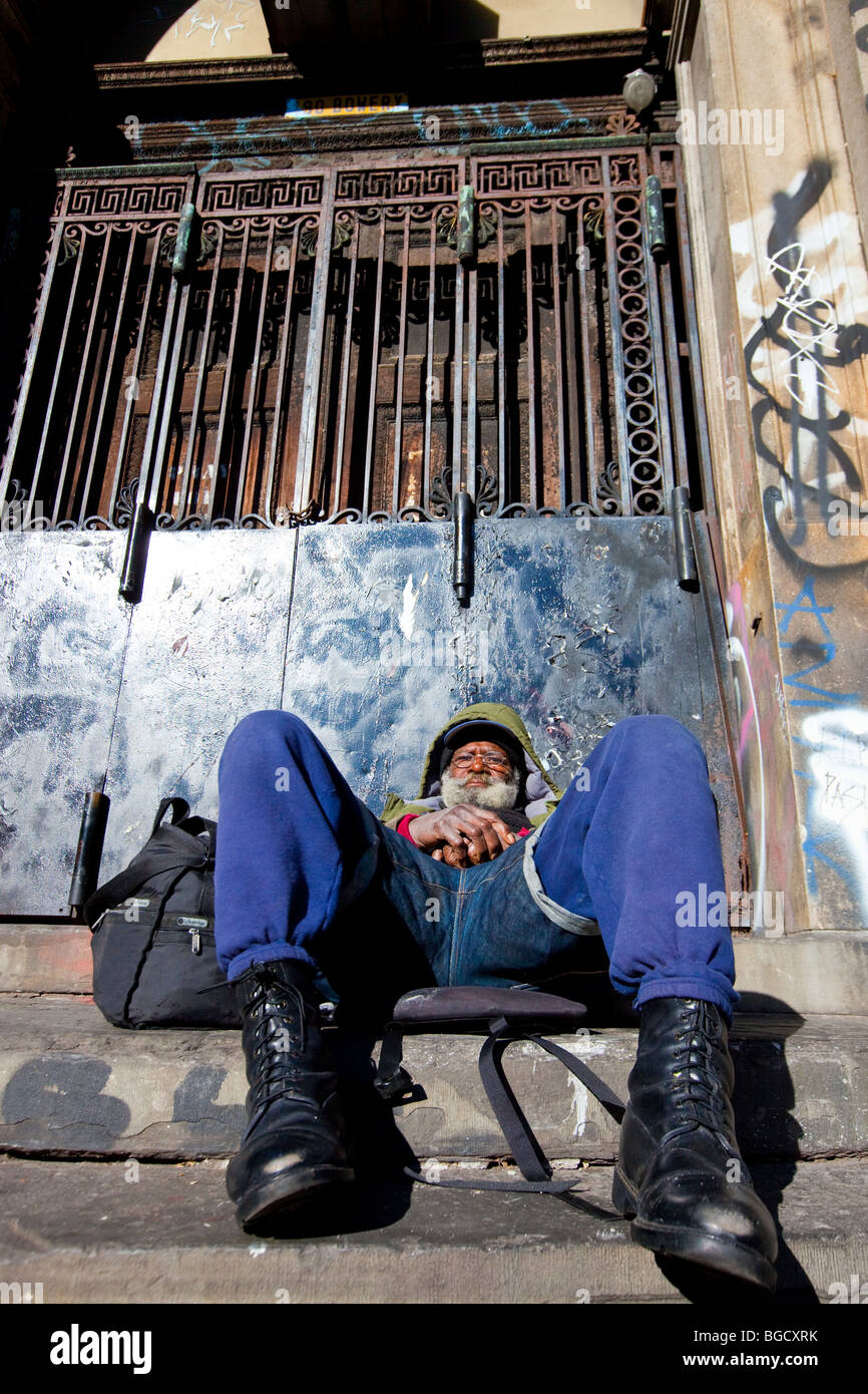 Homeless man in front of 190 Bowery Germania Bank Building, Lower East ...