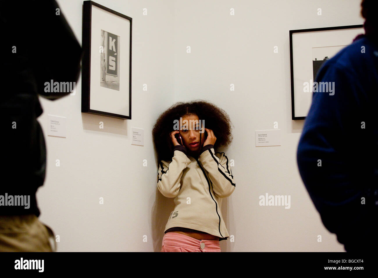 Girl on a cellphone inside MoMa in New York City Stock Photo - Alamy