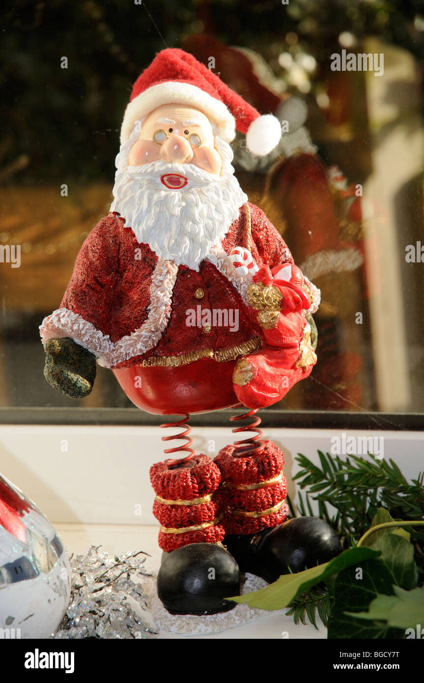 Father Christmas model wearing a traditional Santa suit stands on a ...