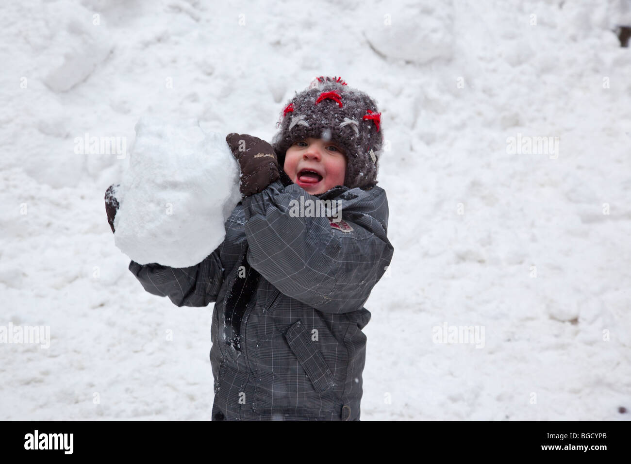 Small boy and a large snowball in Old Quebec City, Canada Stock Photo ...
