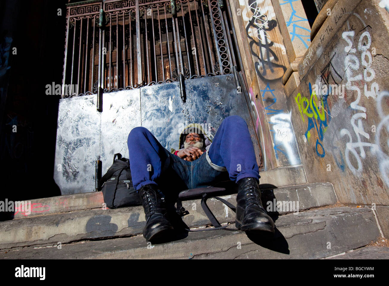 Homeless man in front of 190 Bowery Germania Bank Building, Lower East ...
