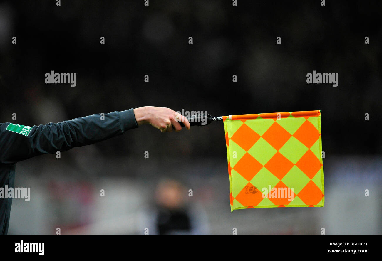 Linesman offside flag Stock Photo - Alamy