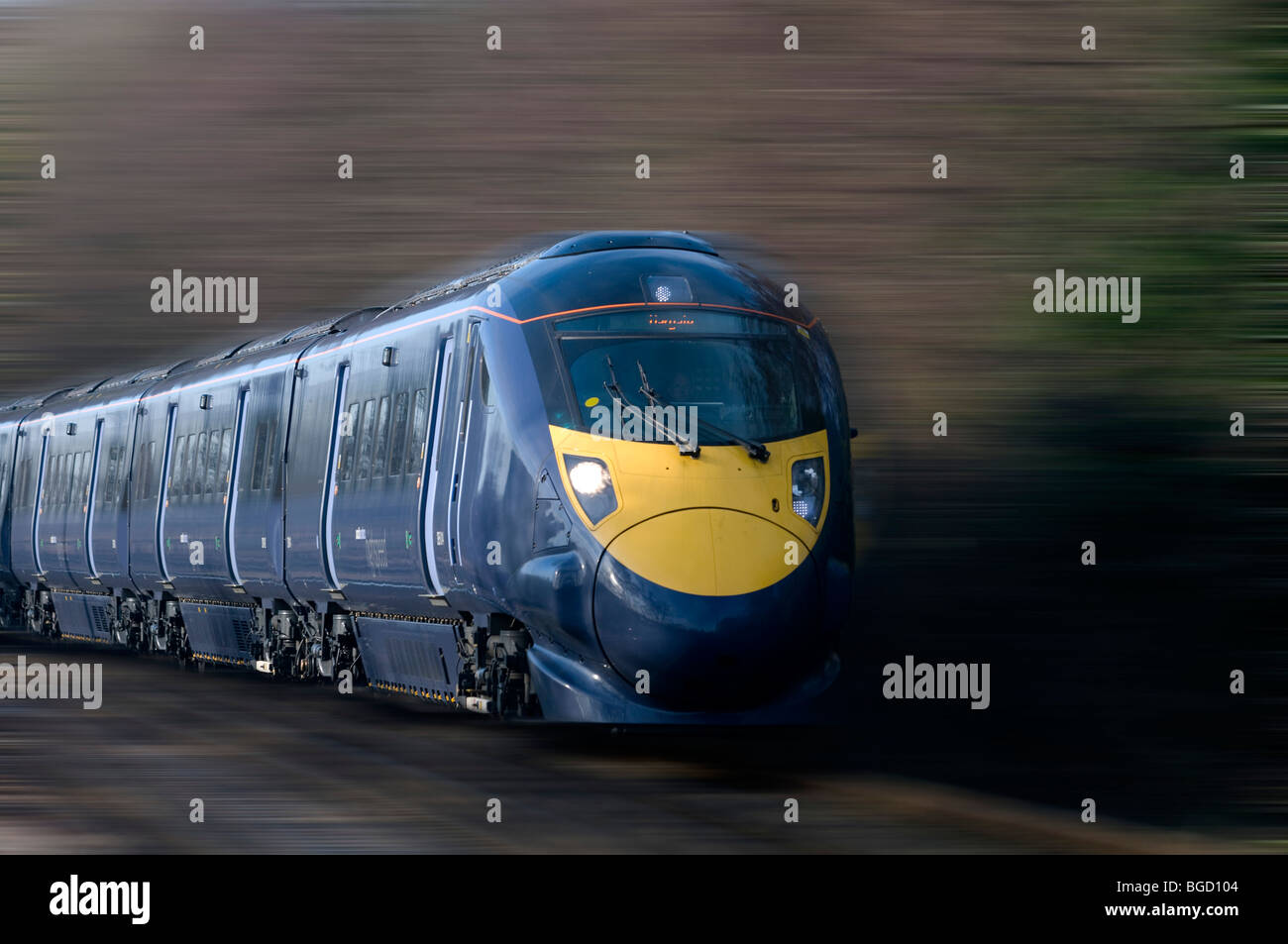 Highspeed train rush through the countryside Stock Photo - Alamy