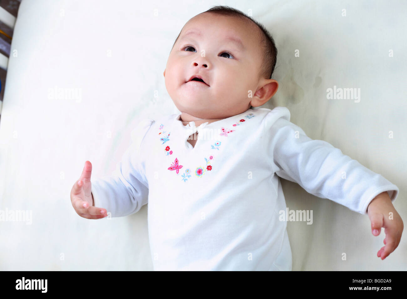 High angle of baby looking up Stock Photo - Alamy
