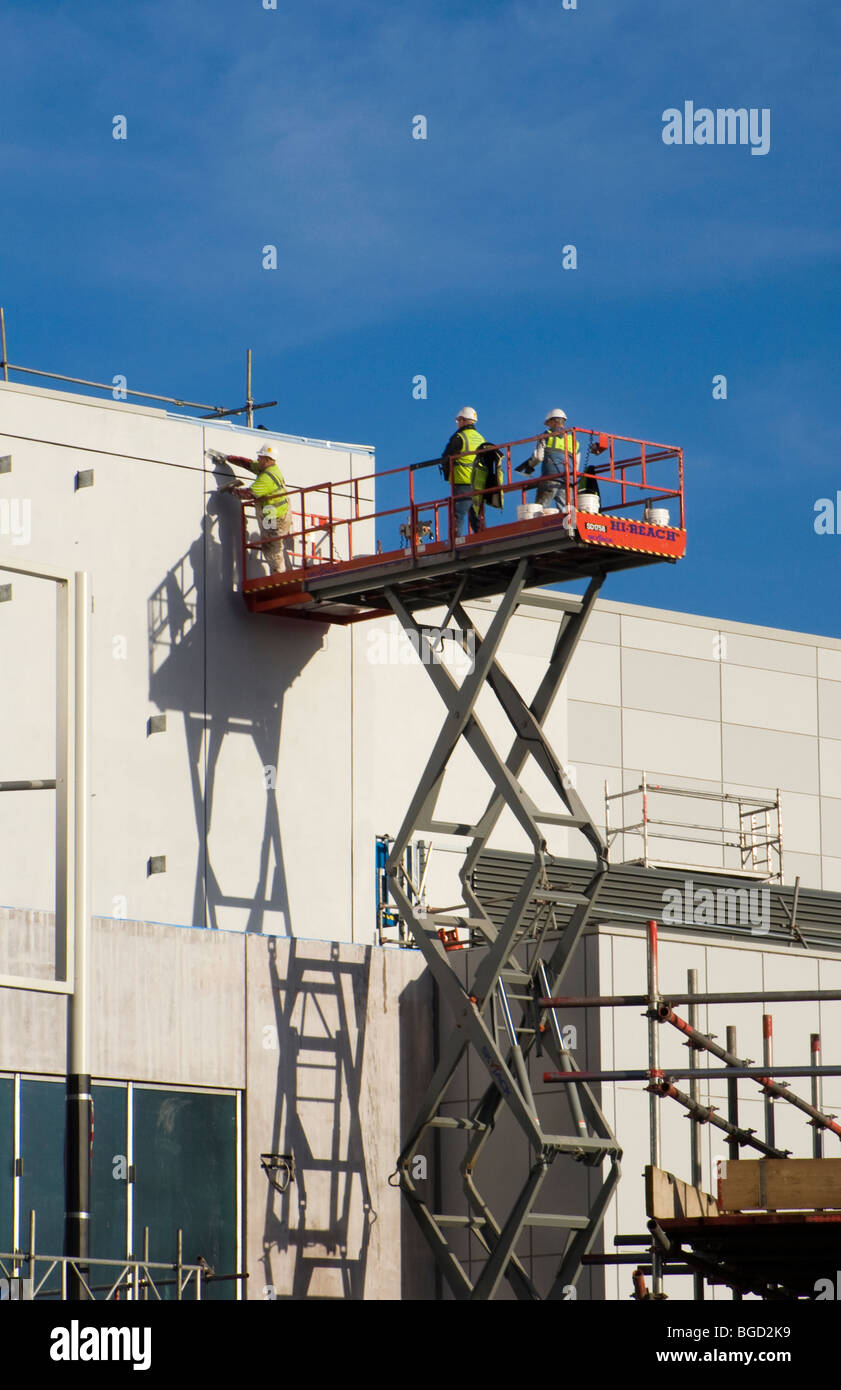 Plasterers using work platform, construction of The Rock shopping and ...