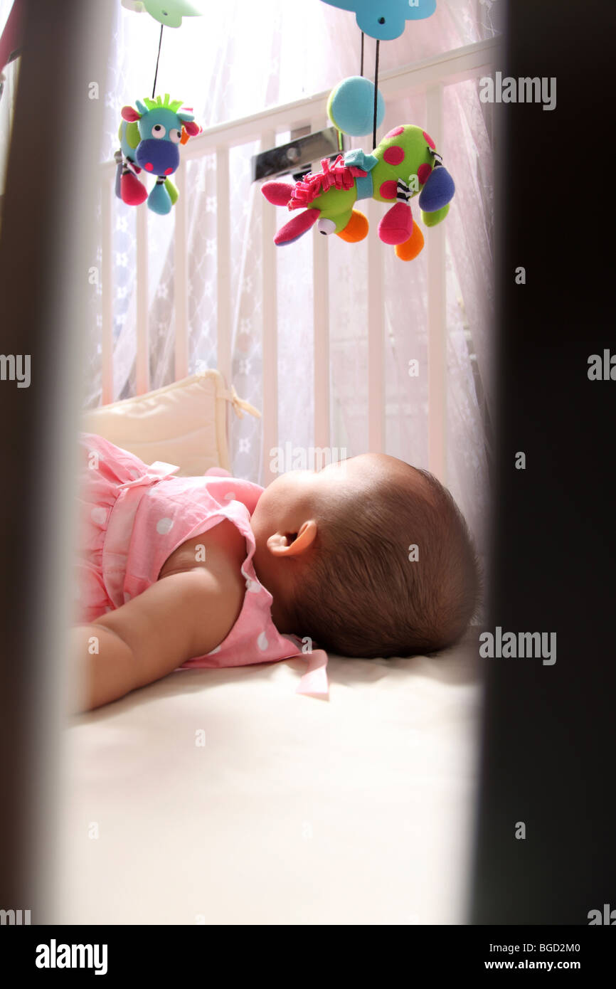 Selective view of baby inside cradle Stock Photo - Alamy