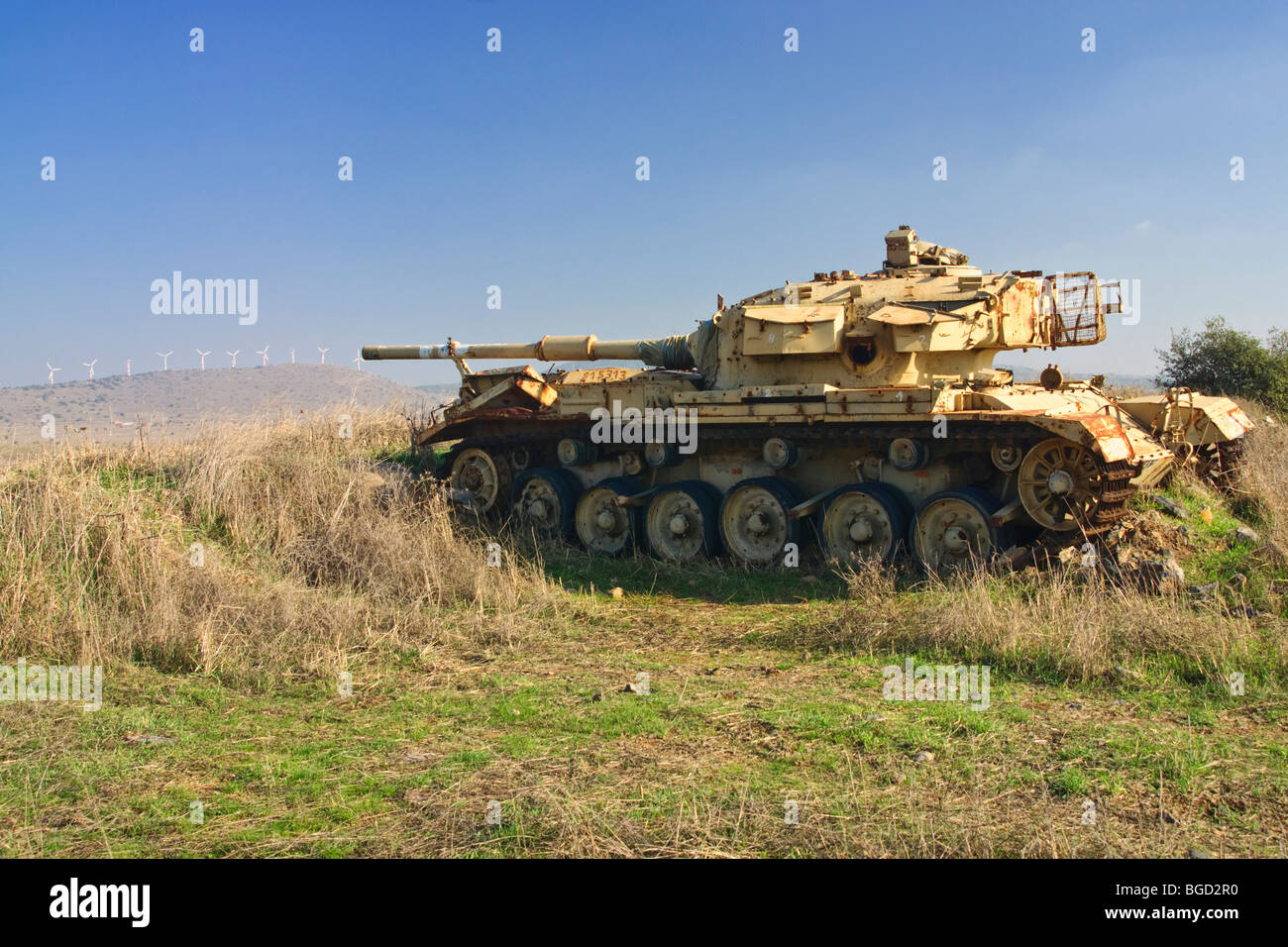 Golan Heights, Israel. Abandoned old tank and new wind turbines Stock ...